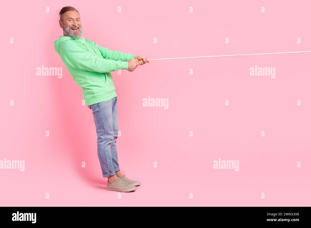 Full size photo of cool pensioner man pulling cheerful rope dressed ...