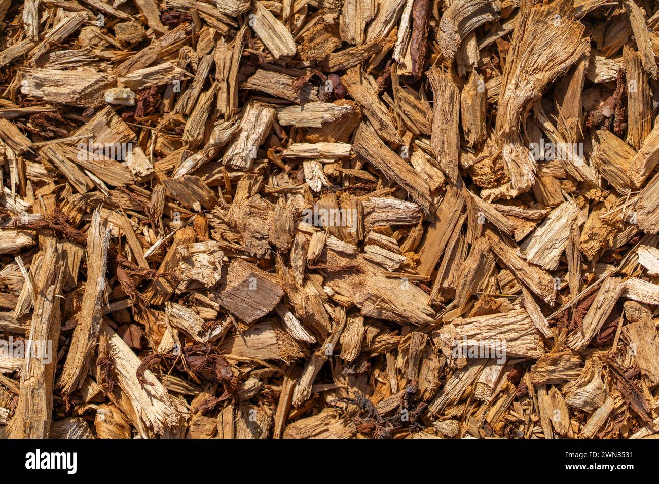 Mulch texture background, pieces of wood layer material on the surface ...