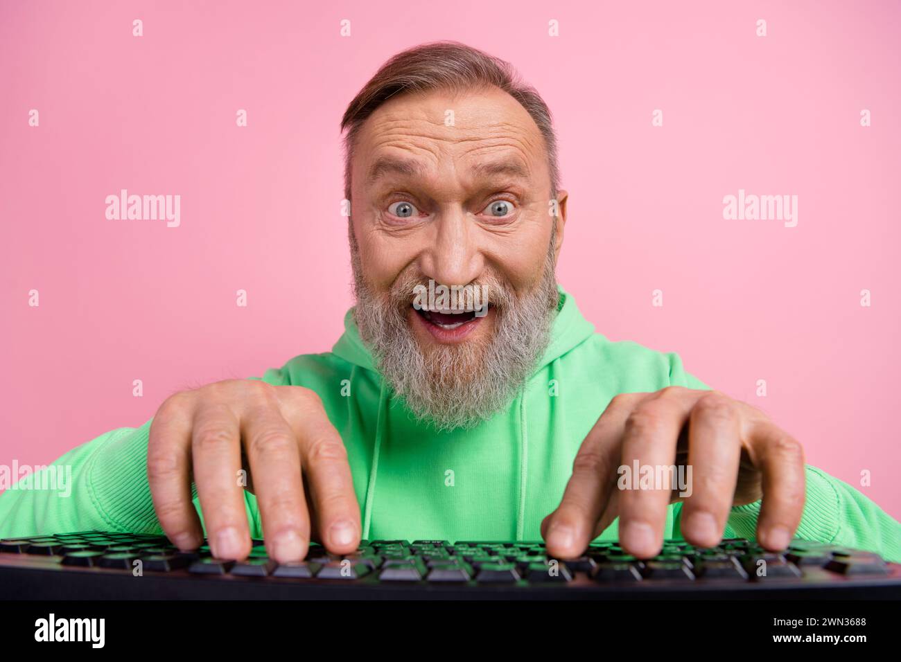 Photo portrait of cool pensioner man excited typing keyboard dressed ...