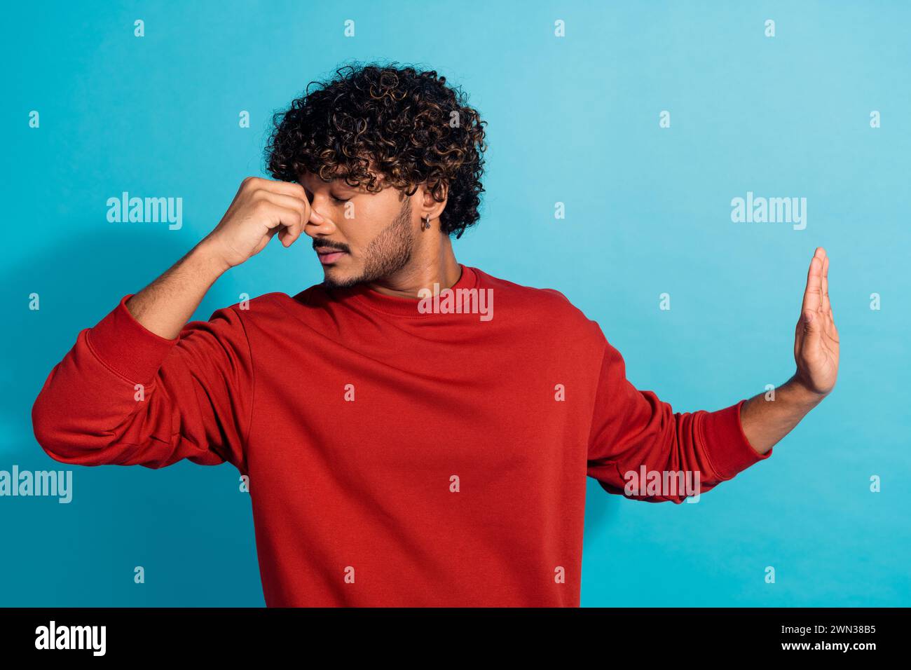 Portrait of unsatisfied guy fingers close nose arm decline reject empty ...