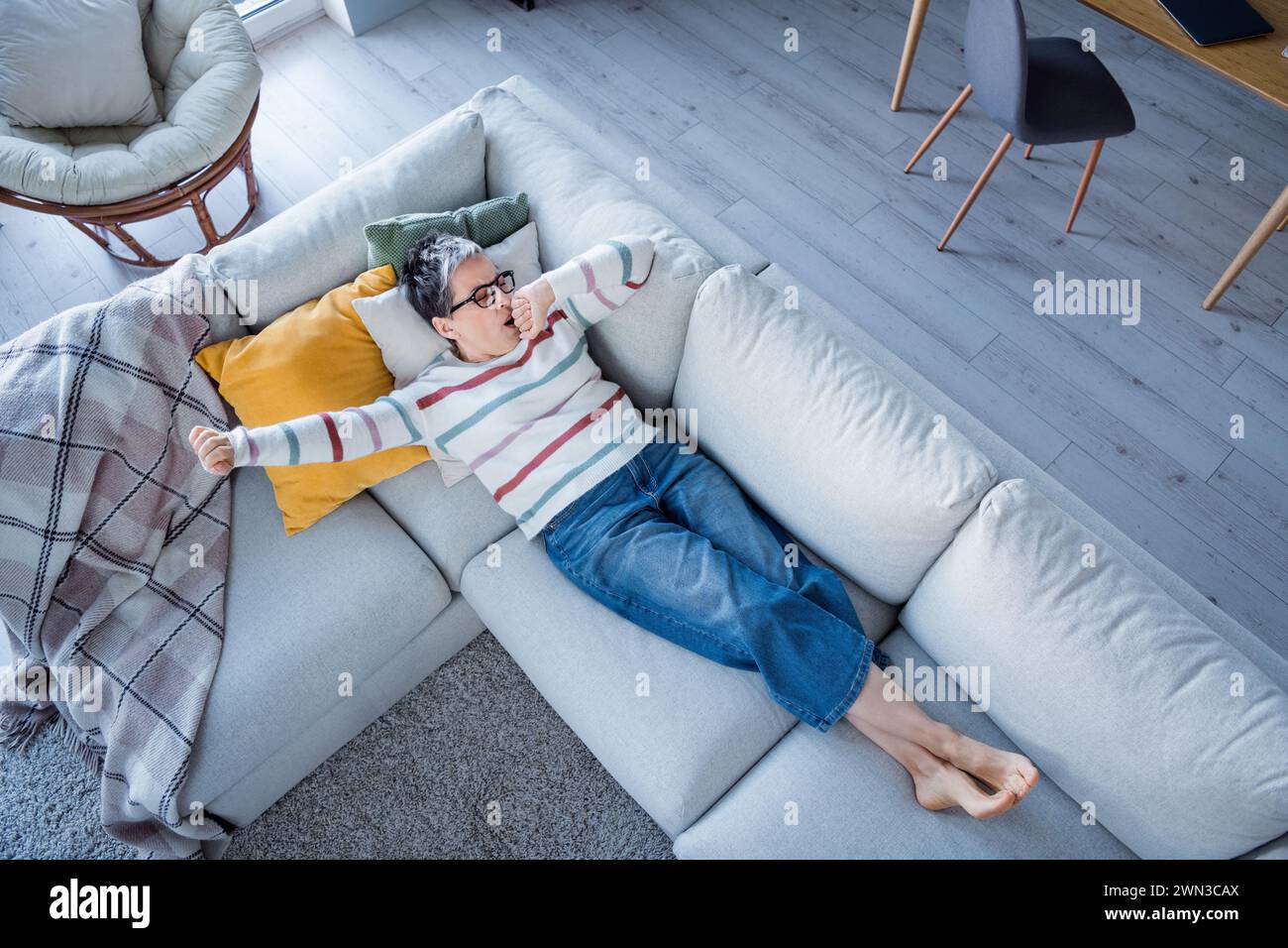 Above view full length portrait of tired aged lady lying comfy sofa ...