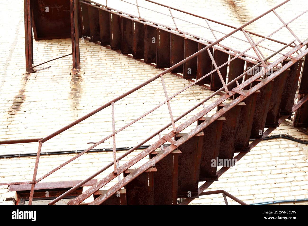 Industrial background. Closeup of high brick wall of old factory with ...