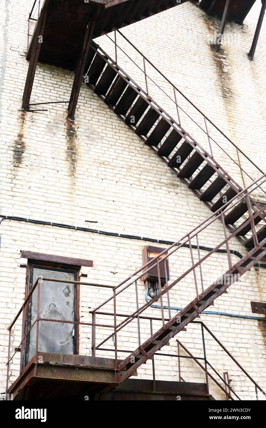 Industrial background. Closeup of high brick wall of old factory with ...