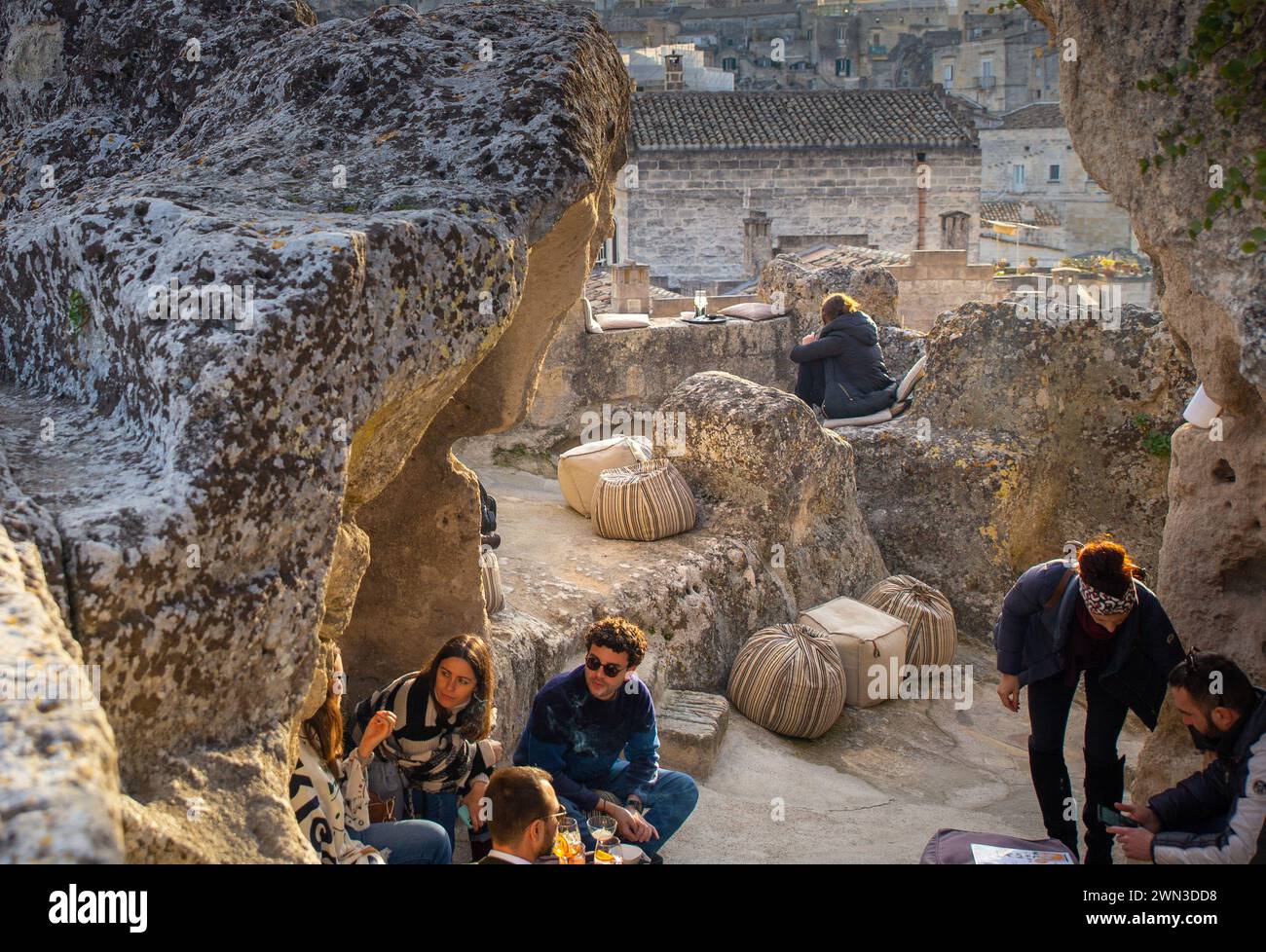 Matera, Italy–Dec 30, 2023: young white boys and girls enjoy vacation ...