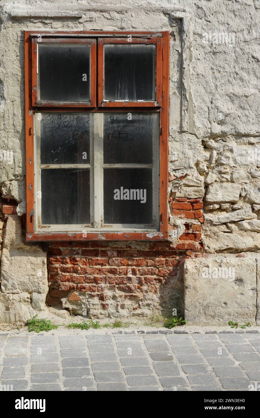 An old brick wall with a window Stock Photo - Alamy