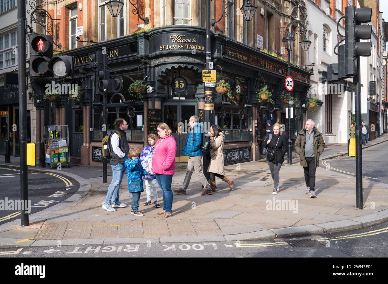 People walking in Soho outside St James Tavern, a traditional pub at ...