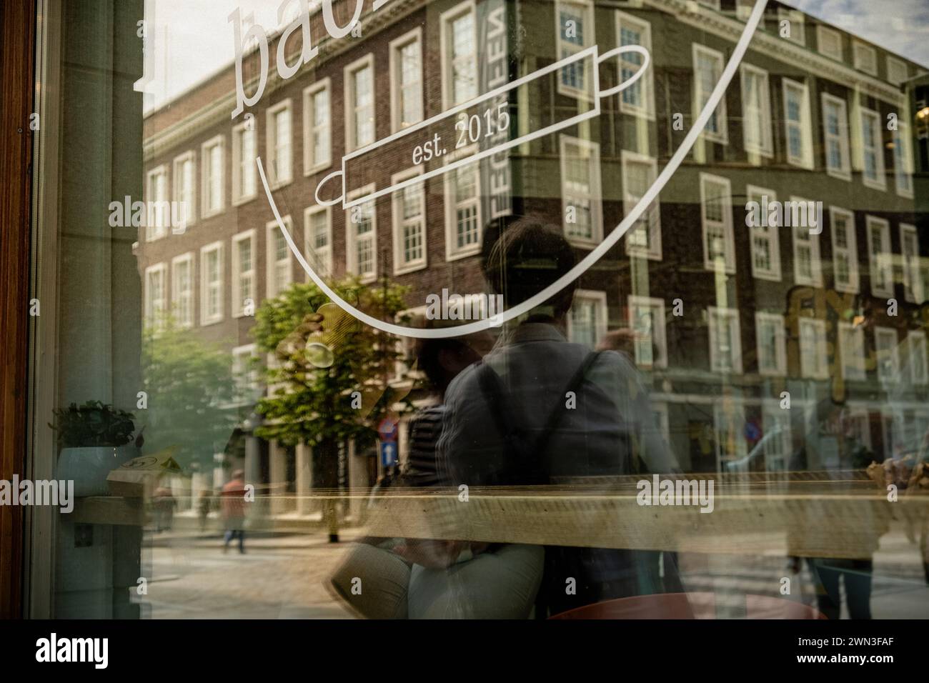 A reflection of store front window with glass display Stock Photo - Alamy