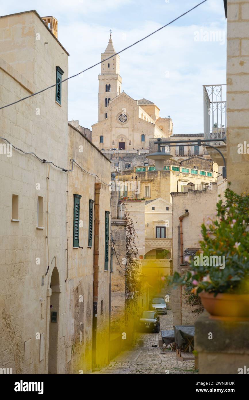 the narrow alley in Matera with catheral of Maria Santissima della ...