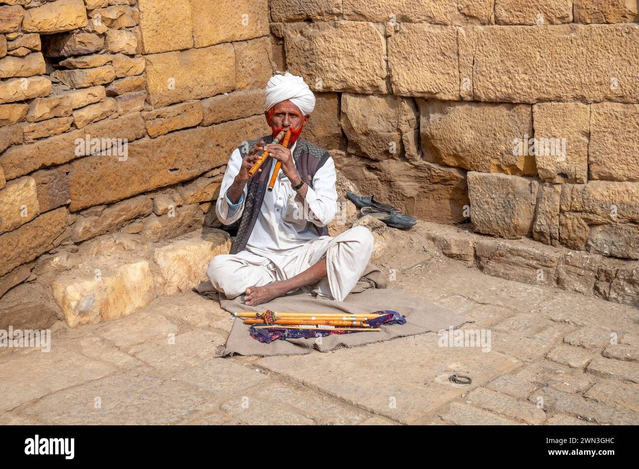 Jaisalmer, India - February 13, 2024: flute playing old man begging for ...