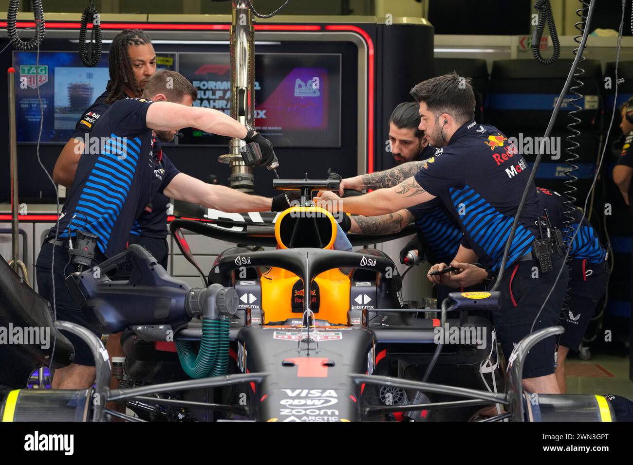 Pit crew from Visa, the team previously known as AlphaTauri work on ...