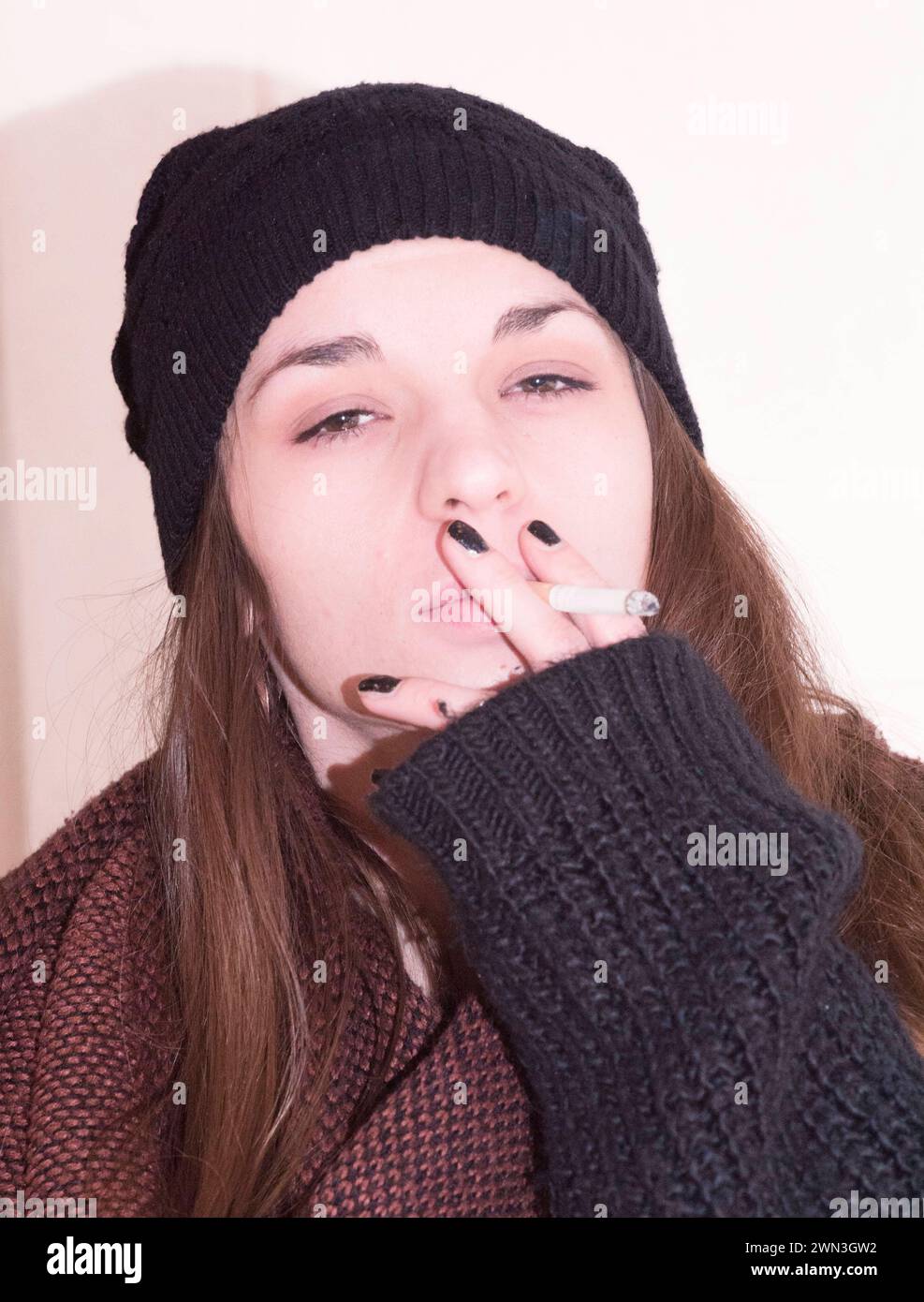 a woman smoking a cigarette, female person with nicotine addiction a ...