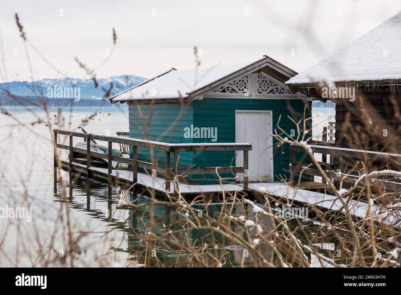 Boathouses with snow in winter, Tutzing, Lake Starnberg, Fuenfseenland ...