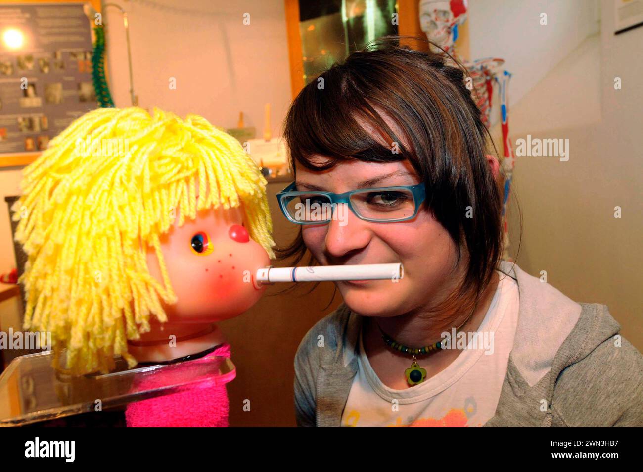 a woman smoking a cigarette, female person with nicotine addiction a ...