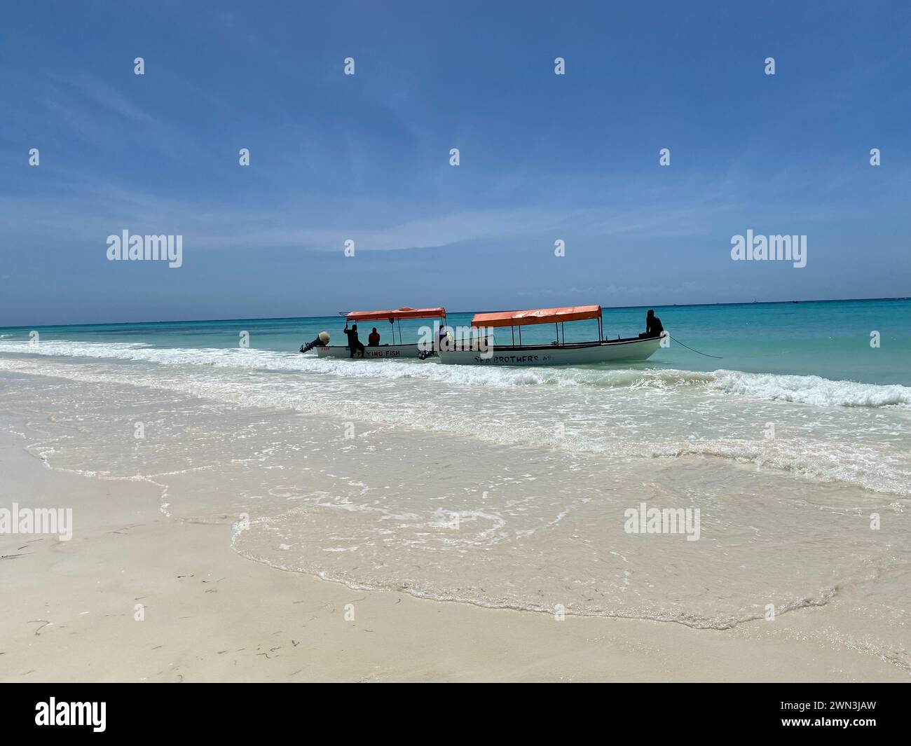 Two boats in Zanzibar, blue sky and sunny Stock Photo - Alamy