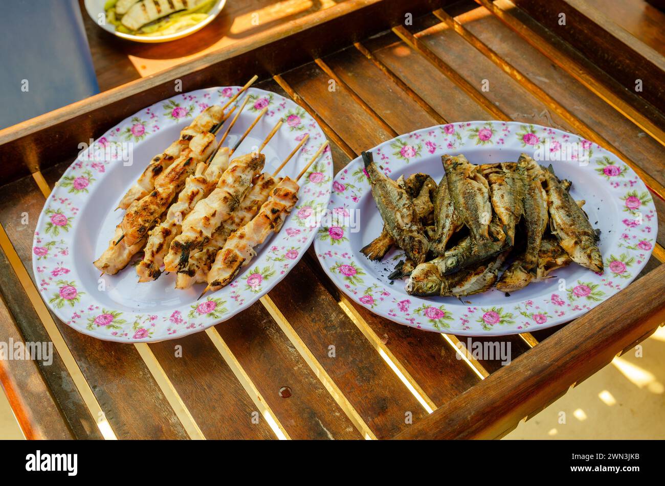 Two servings of food on a tray placed side by side Stock Photo - Alamy