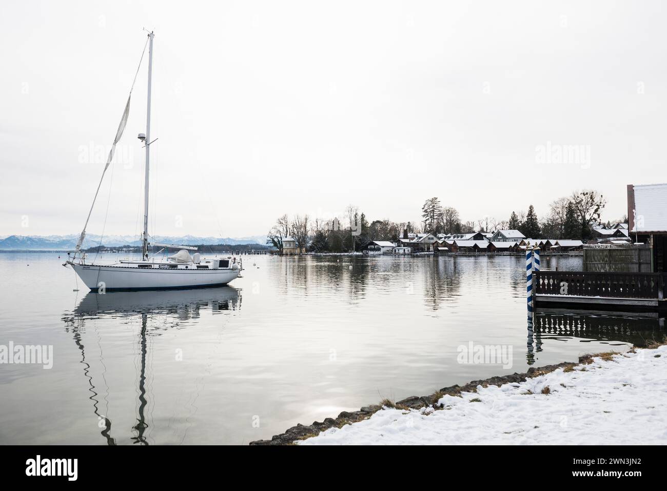 Boathouses with snow in winter, Tutzing, Lake Starnberg, Fuenfseenland ...