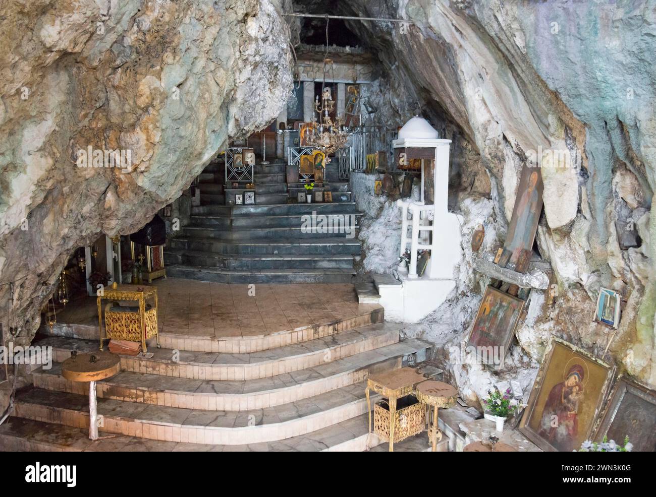 Interior view of a chapel built into the cave with steps and candles ...
