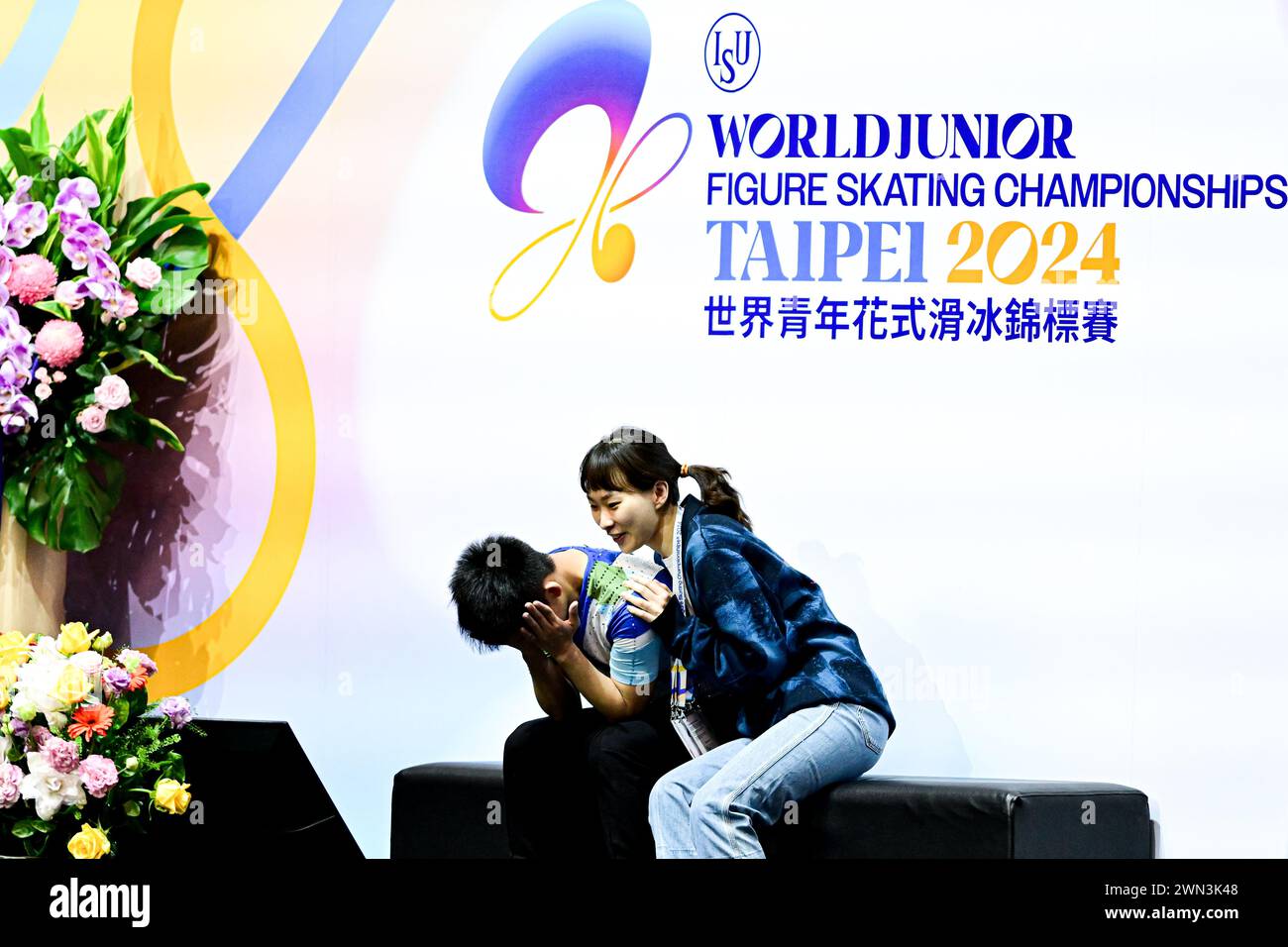 Yu-Hsiang LI (TPE), at Kiss & Cry, during Junior Men Short Program, at ...