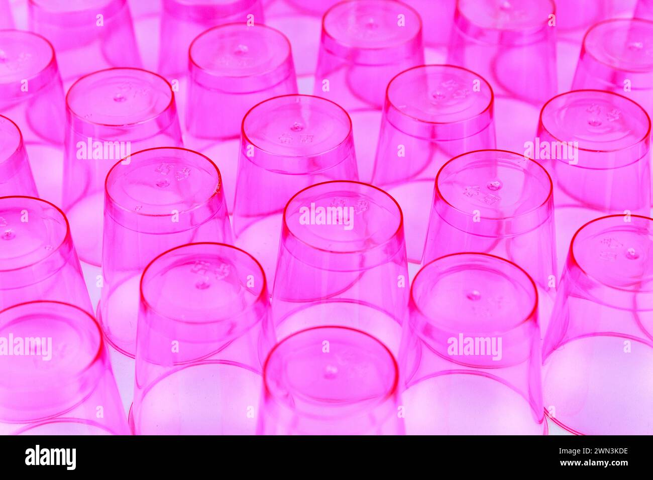 Plastic pink cups abstract background Stock Photo - Alamy