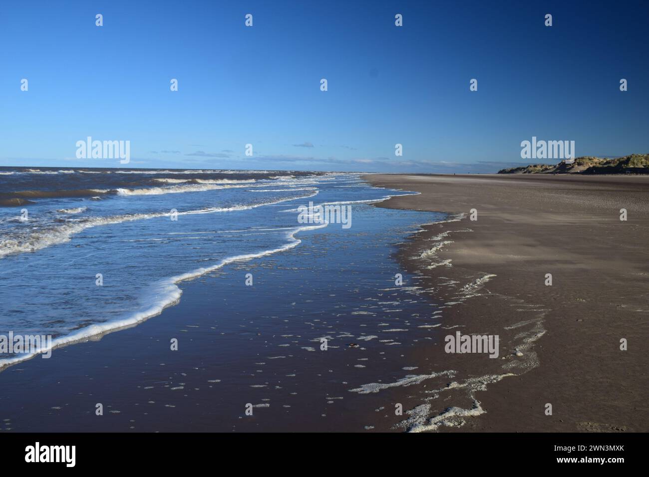 The sand dunes and beach along the Merseyside coast facing onto ...