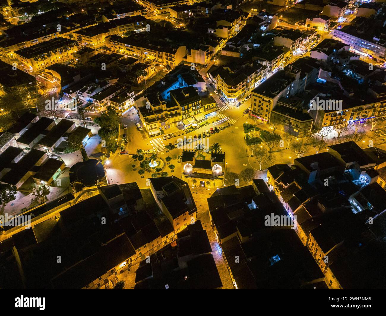 Aerial view of illuminated streets and city lights at night Stock Photo ...