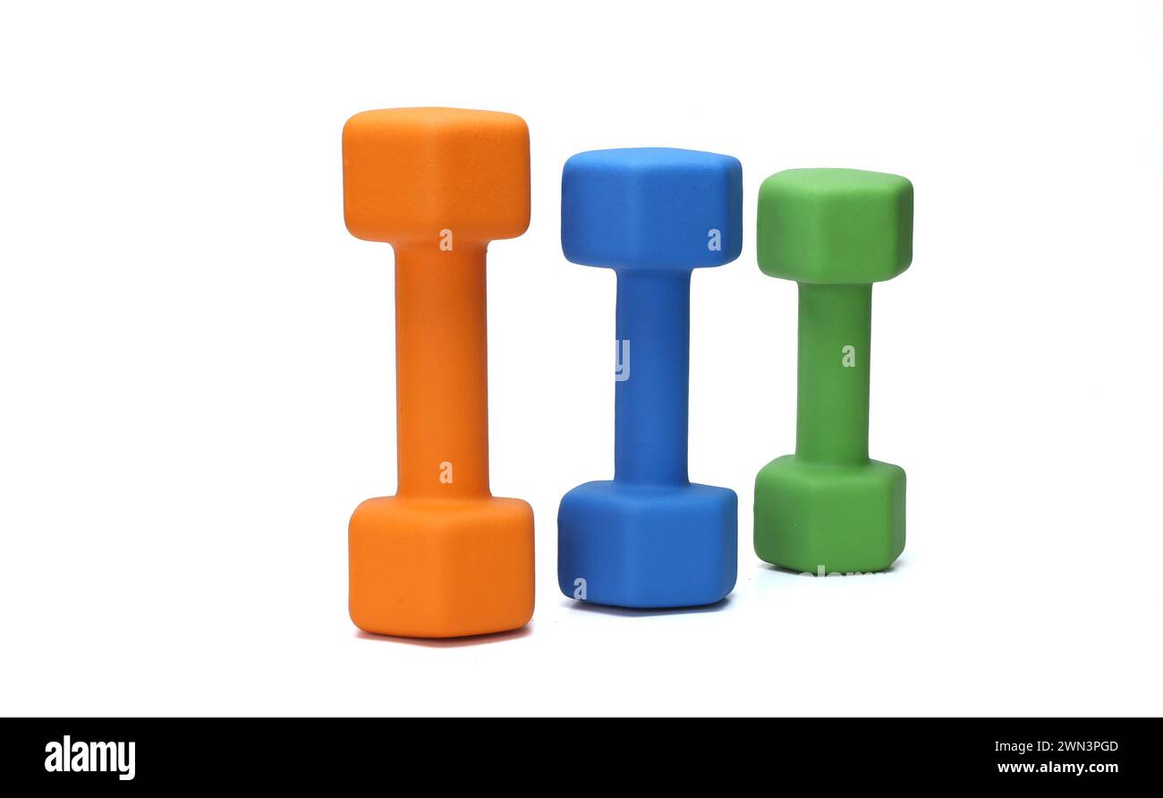 colorful rubber coated dumbbells isolated on white background Stock ...