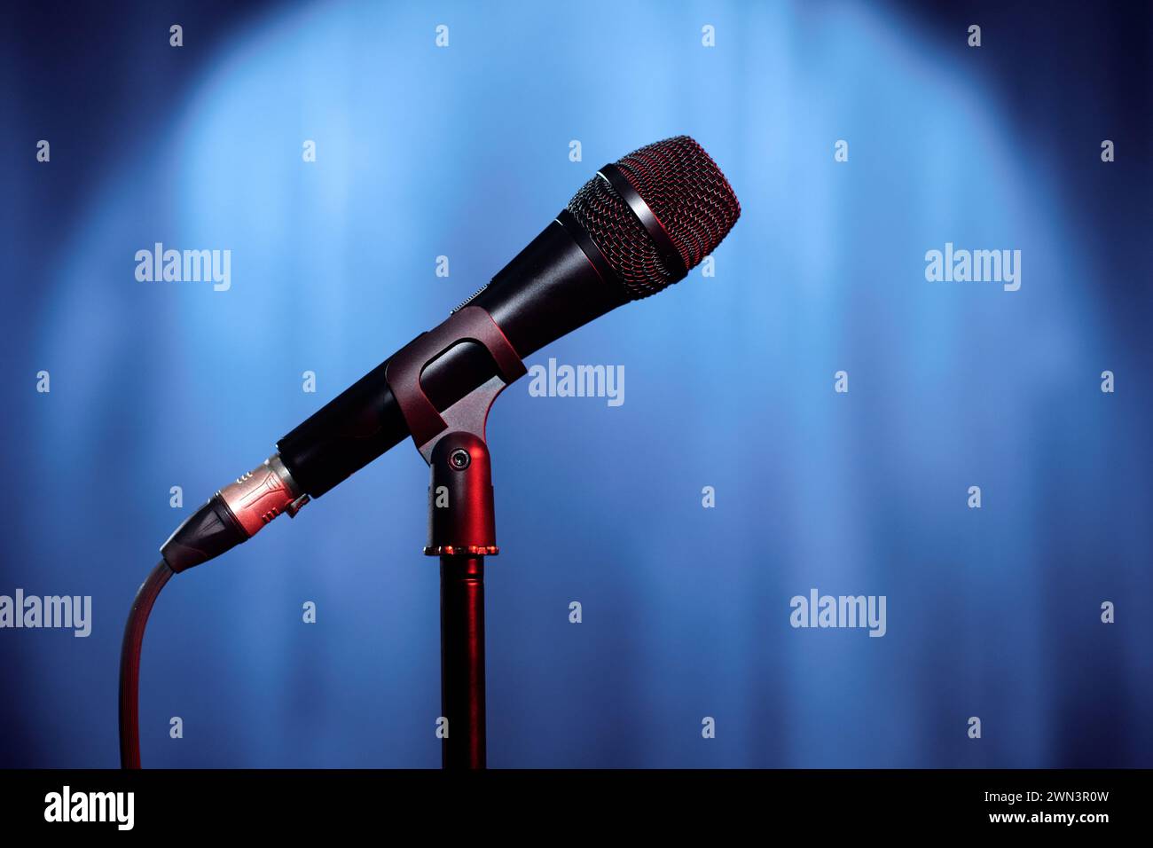 Microphone of presenter or participant of evening show standing on ...