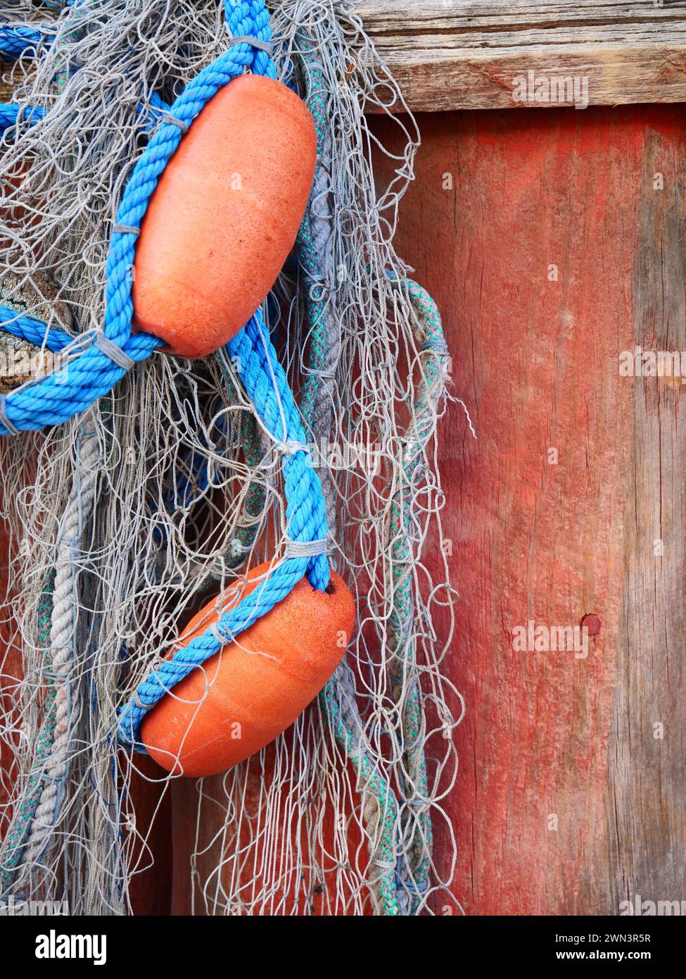 The buoys suspended on a building with a blue rope Stock Photo - Alamy