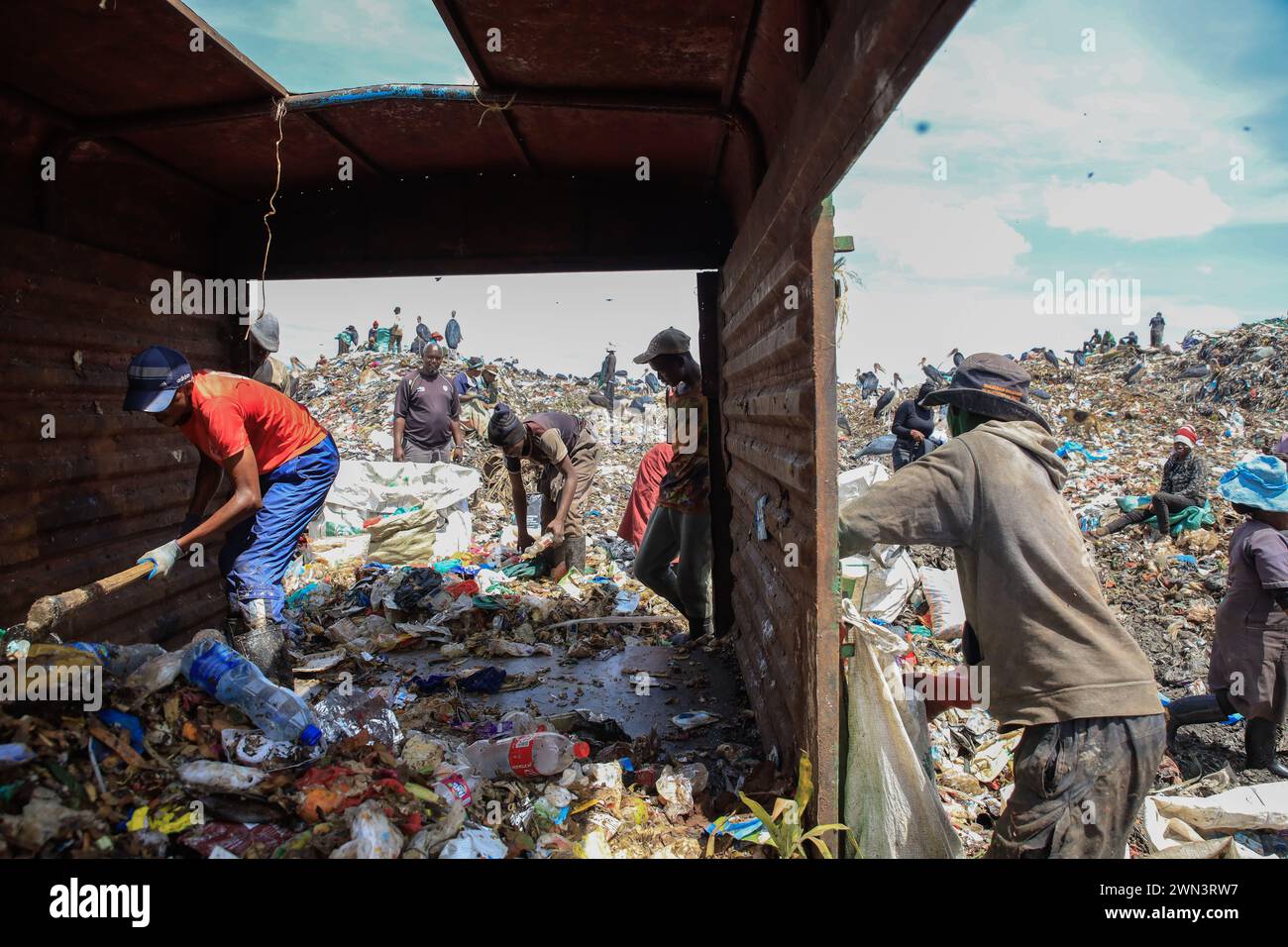 Nairobi, KENYA. 28th Feb, 2024. Waste collectors offloading waste ...
