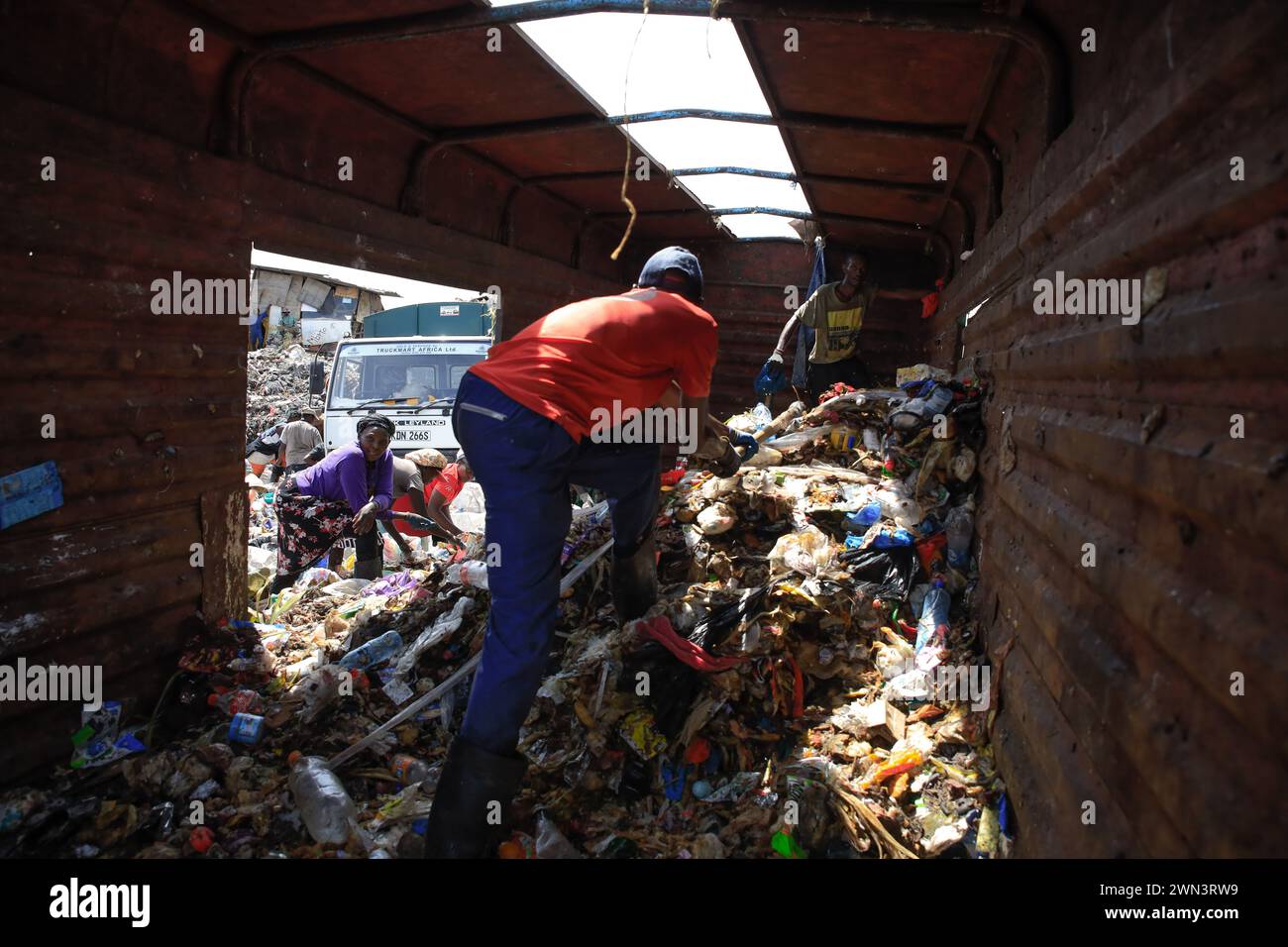 Nairobi, KENYA. 28th Feb, 2024. Waste collectors offloading waste ...