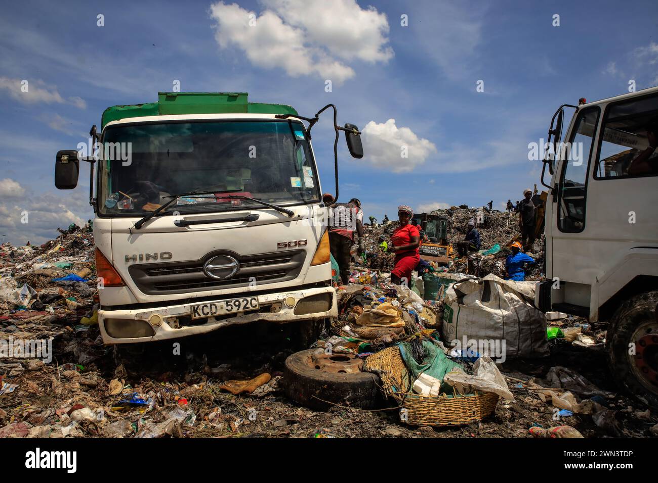 Nairobi, KENYA. 28th Feb, 2024. Waste collectors offloading waste ...