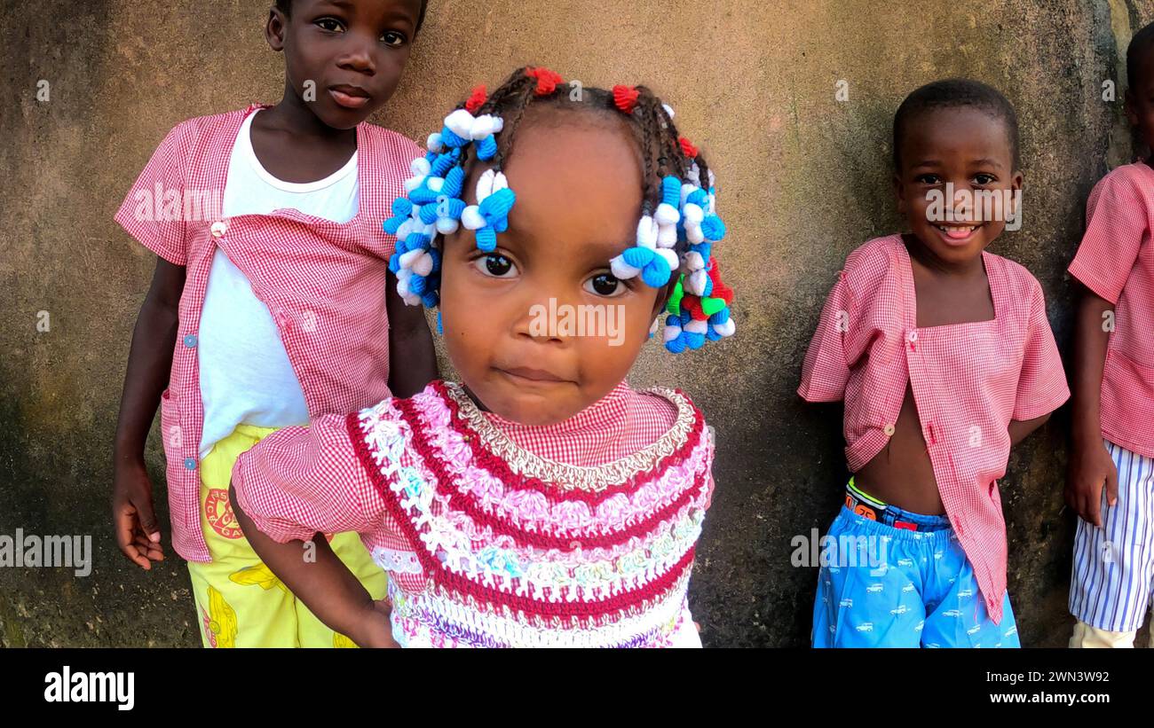The Two young girls posing and smiling for a photo in Sao Tome and ...
