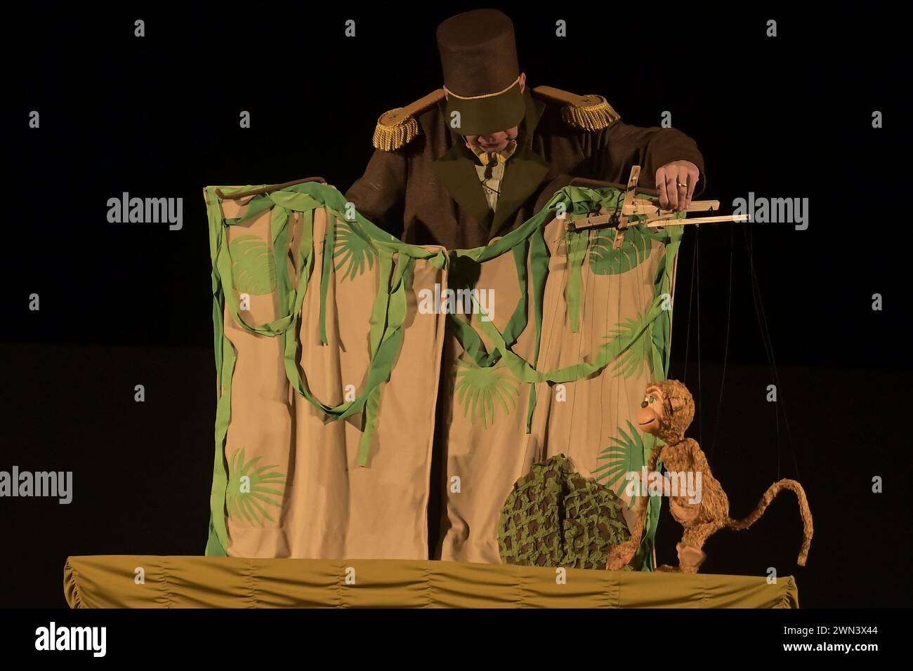 American puppeteer performs with puppets during Tripura International ...