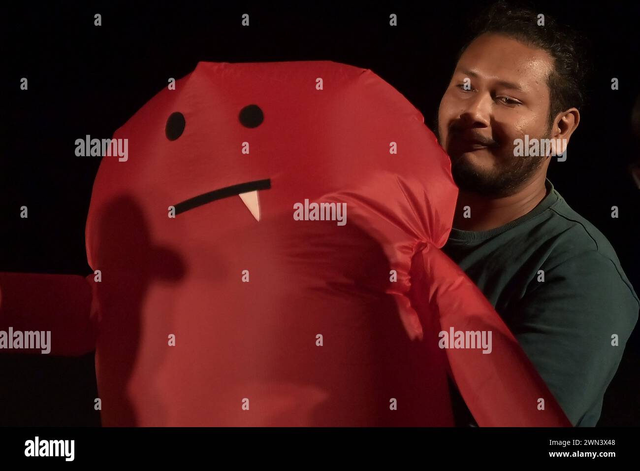 Puppeteers perform with puppets during the Tripura International Puppet ...