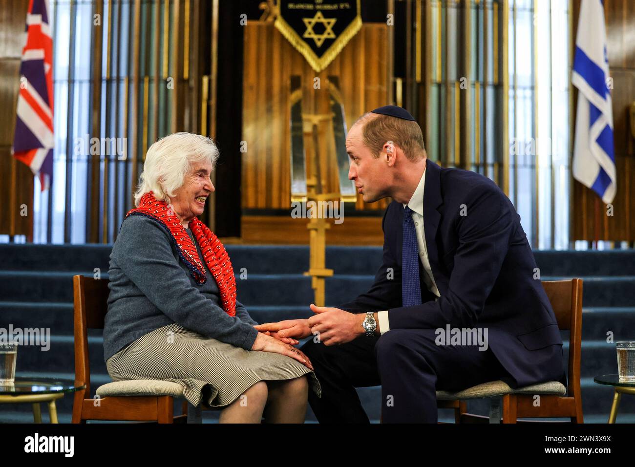 The Prince of Wales touches the hand of Renee Salt, 94, a Holocaust ...