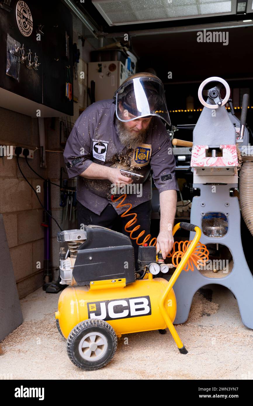 14/04/22 Chris uses a JCB air compressor to blow away saw-dust ...
