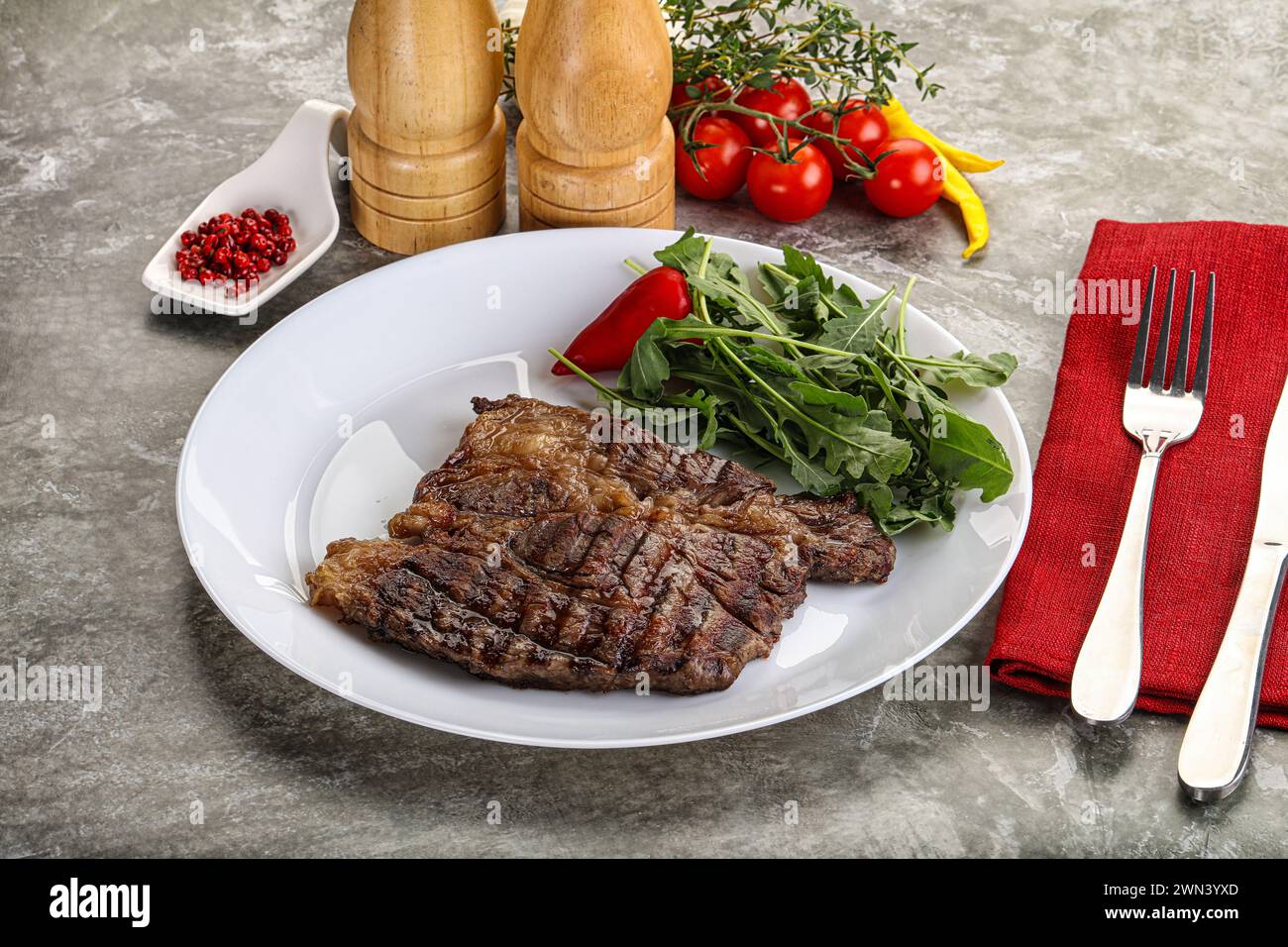 Grilled chuck roll beef steak with arugula Stock Photo - Alamy