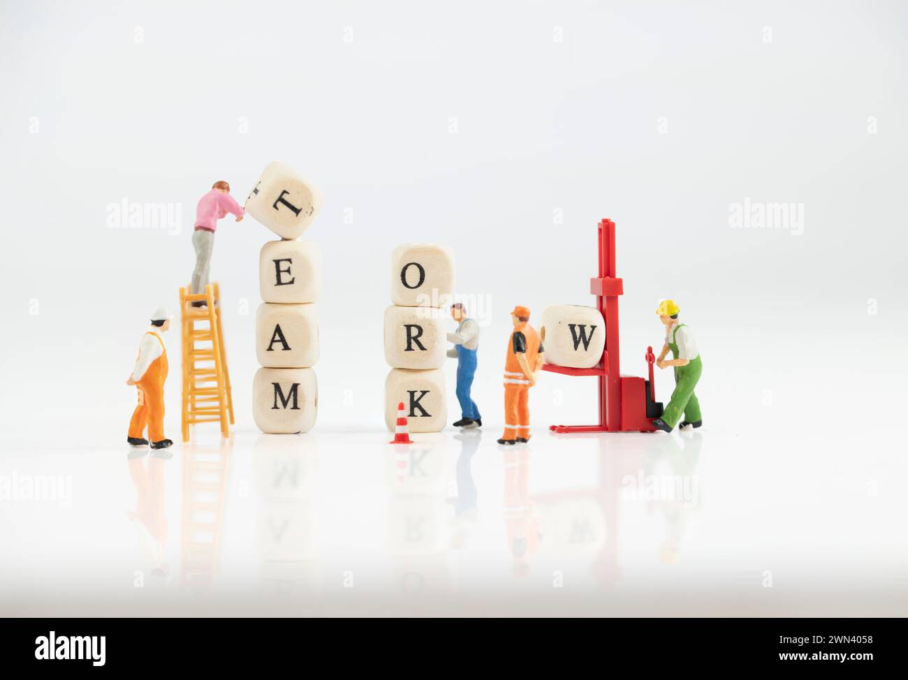 little world miniatures building teamwork Stock Photo - Alamy