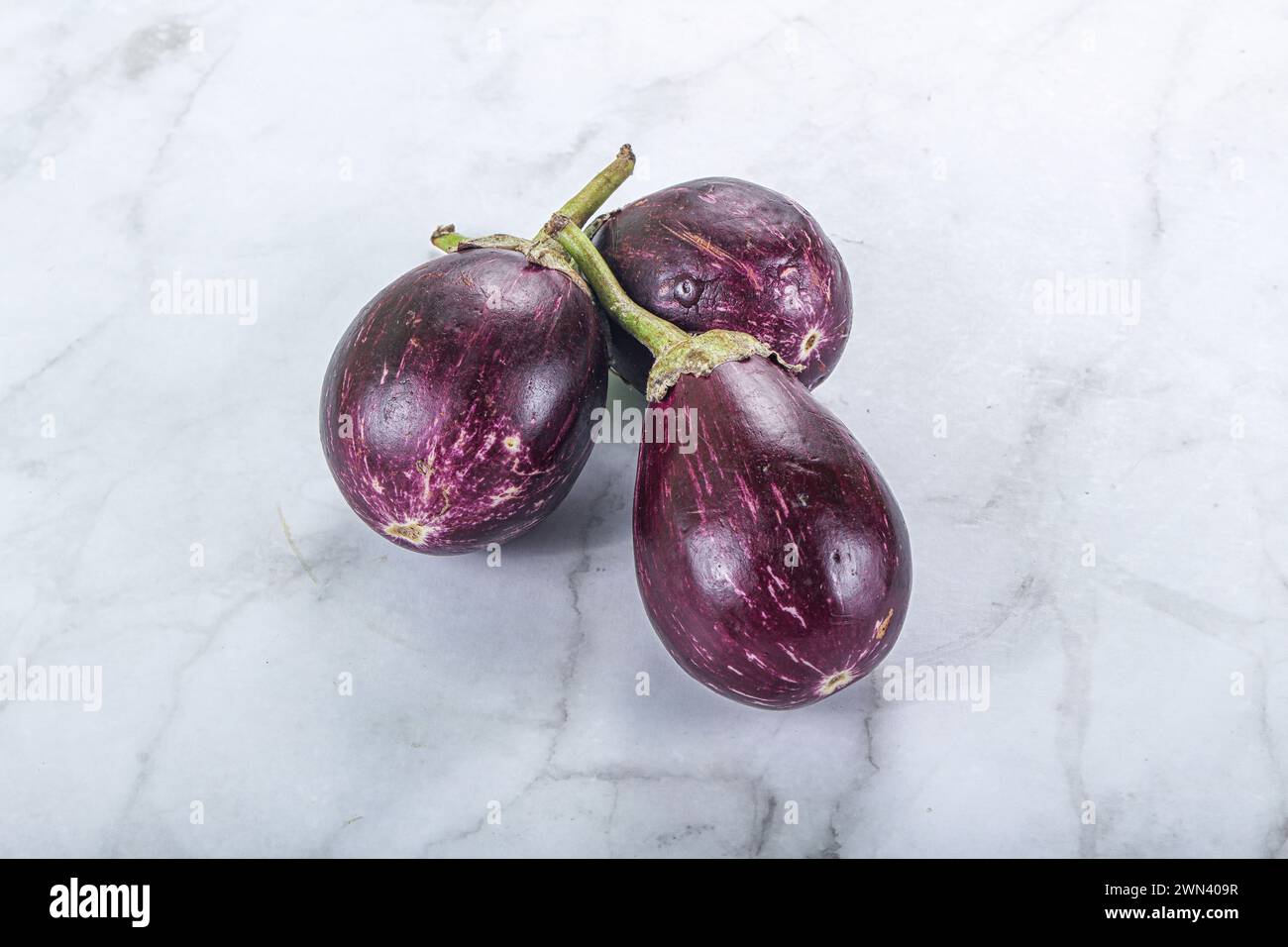 Raw smal asian baby violet eggplant Stock Photo - Alamy