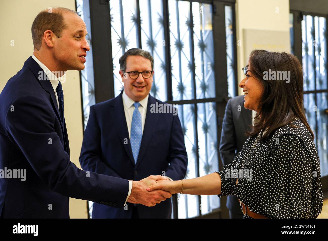 The Prince of Wales shakes hands with Karen Pollock, CEO of the ...
