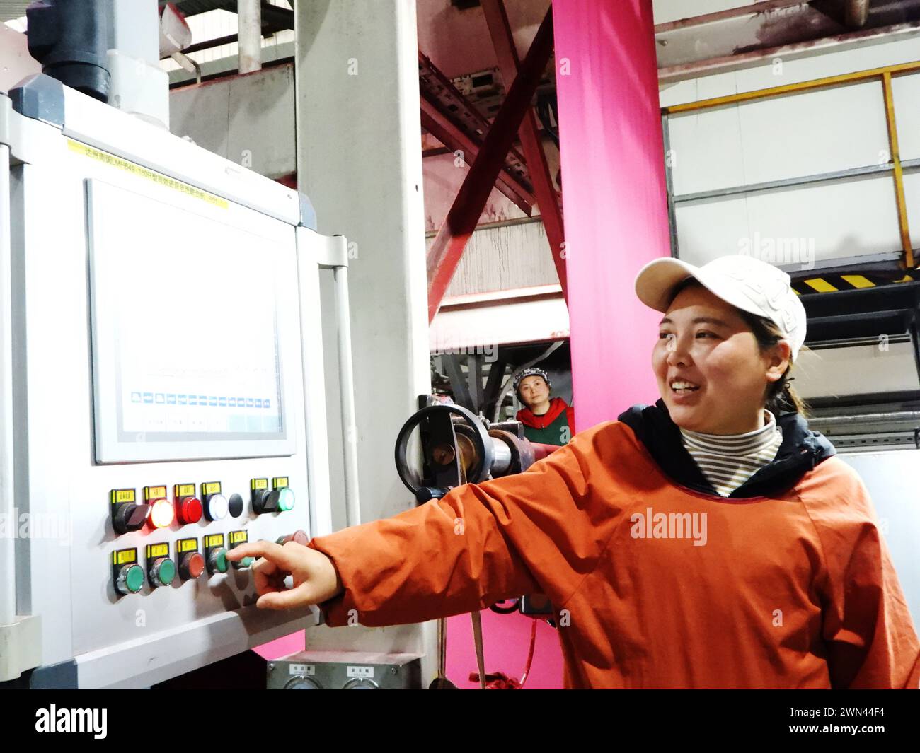 DAZHOU, CHINA - FEBRUARY 29, 2024 - A worker produces cotton products for export to Europe and ...