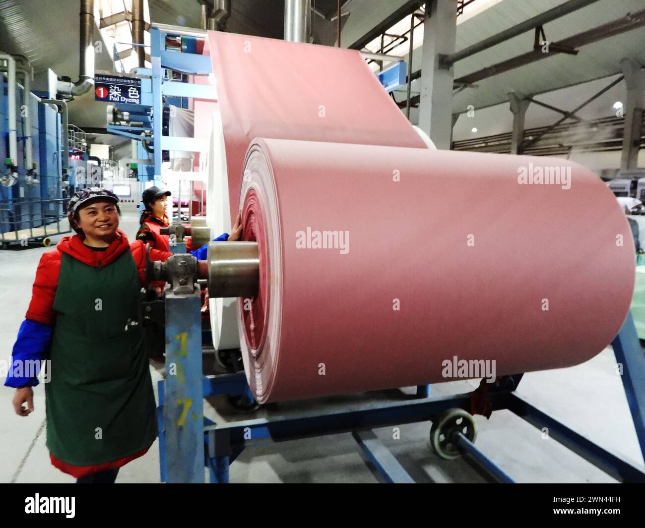 DAZHOU, CHINA - FEBRUARY 29, 2024 - A worker produces cotton products for export to Europe and ...