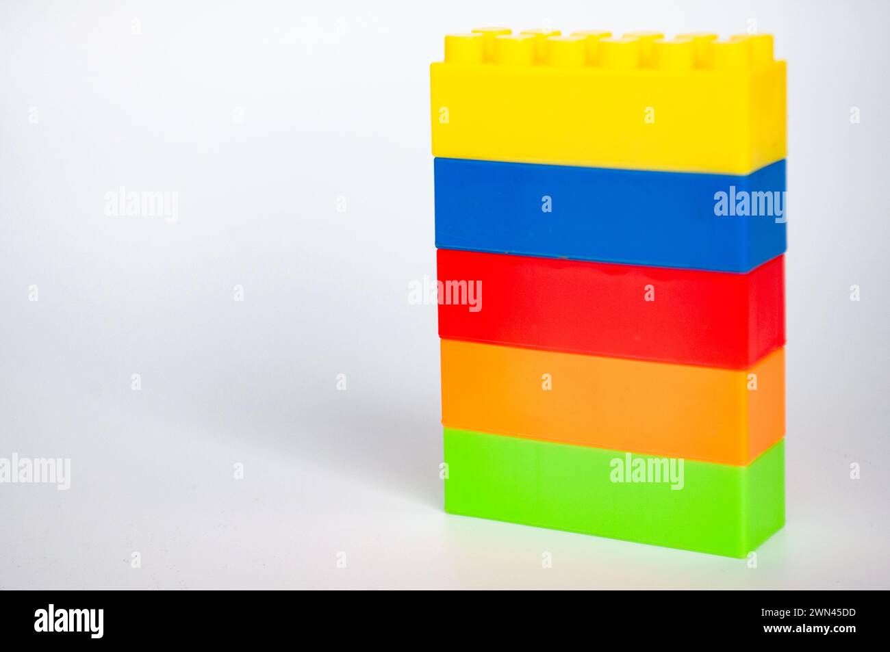 Hand stacking up lego set with customizable space for text Stock Photo ...