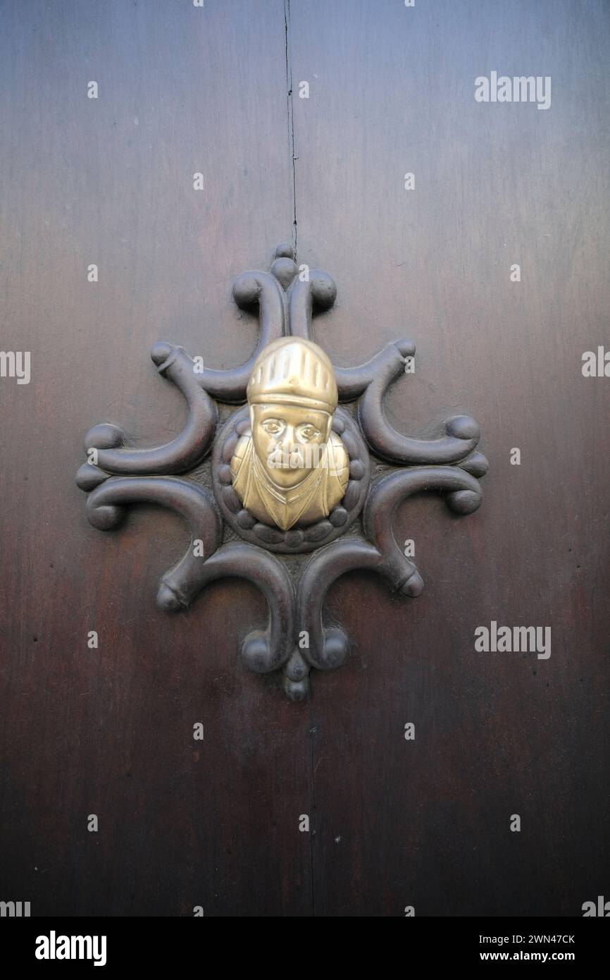 A symbolic metal handle in the shape of a man in a helmet adorns the ...