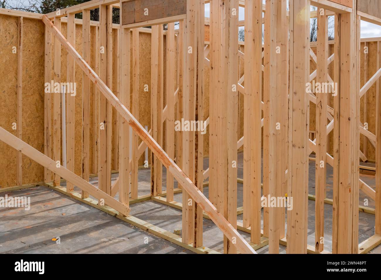 When constructing new home, wooden stick beams used in framing process ...
