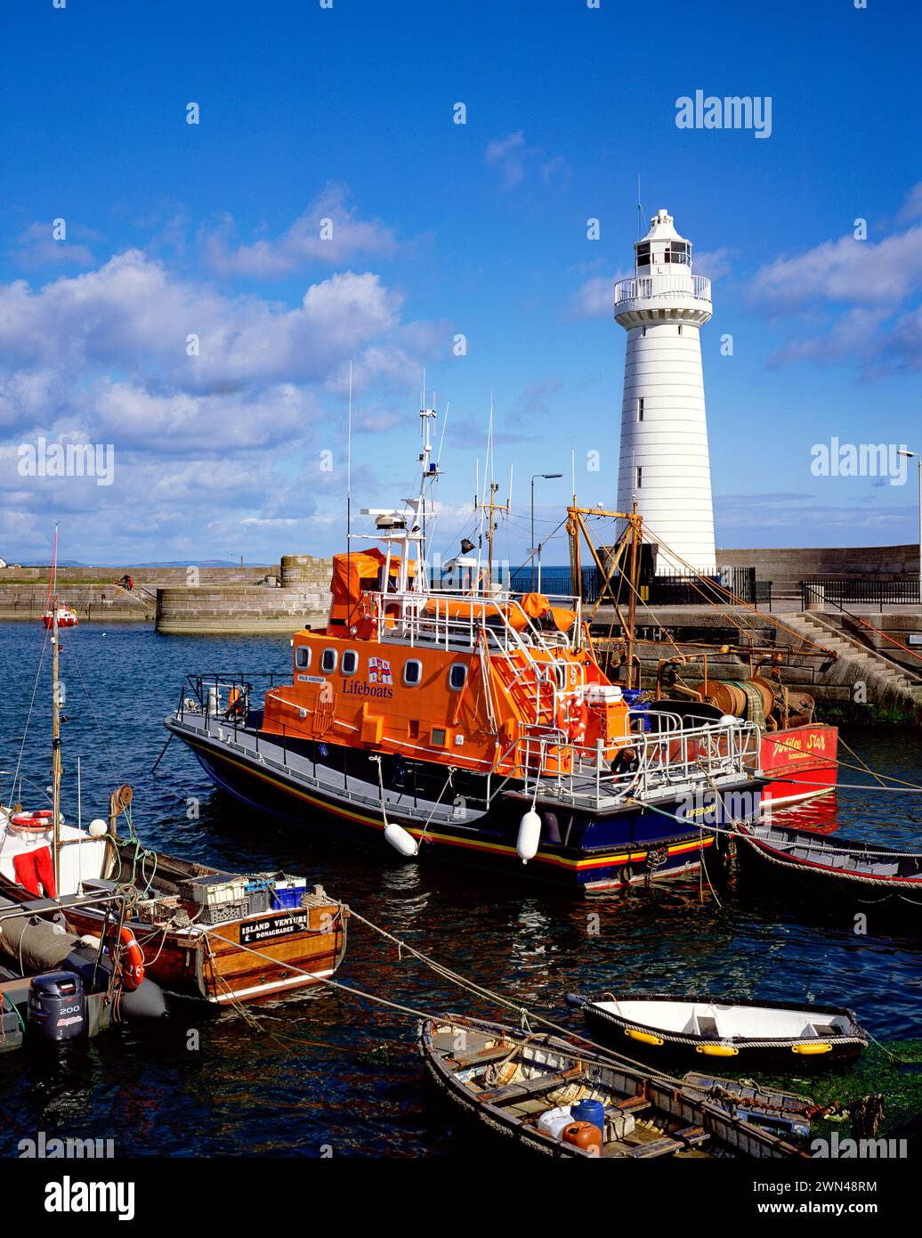 Donaghadee Lighthouse and Harbour with fishing and pleasure boats ...