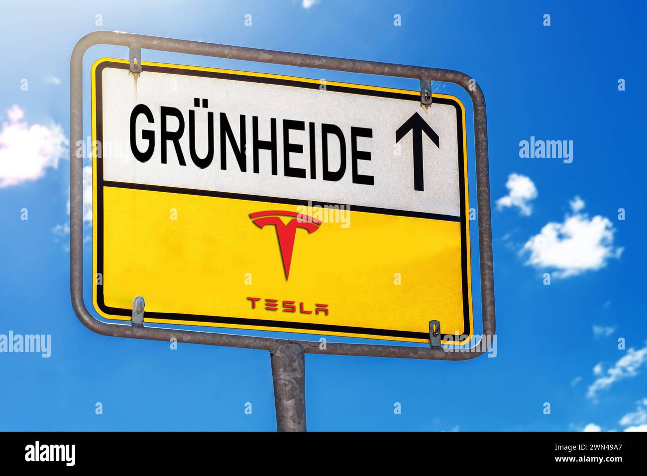 Germany - February 29, 2024: Town sign with Tesla logo and the ...