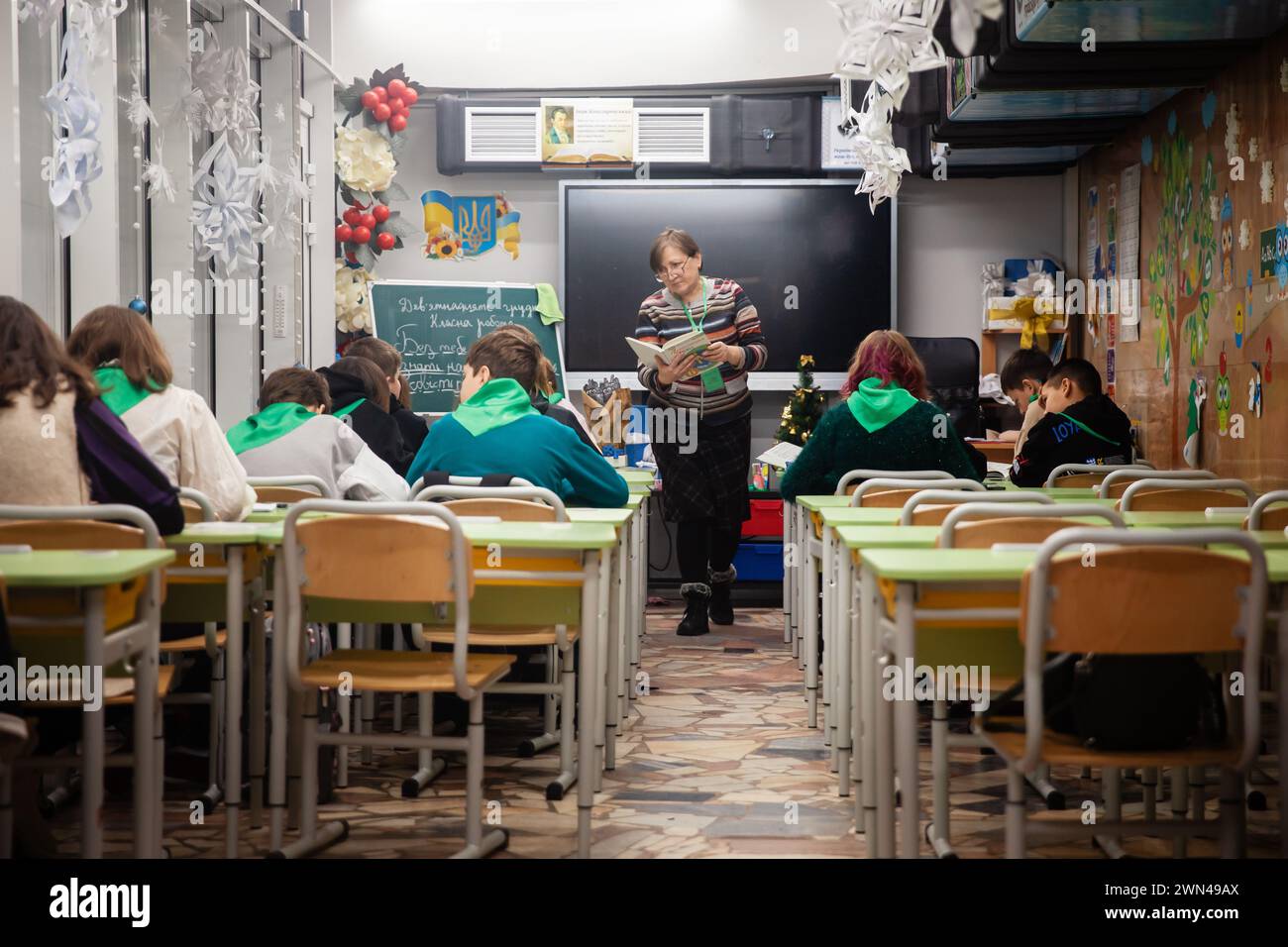 The teacher is seen during class lessons with children in school ...