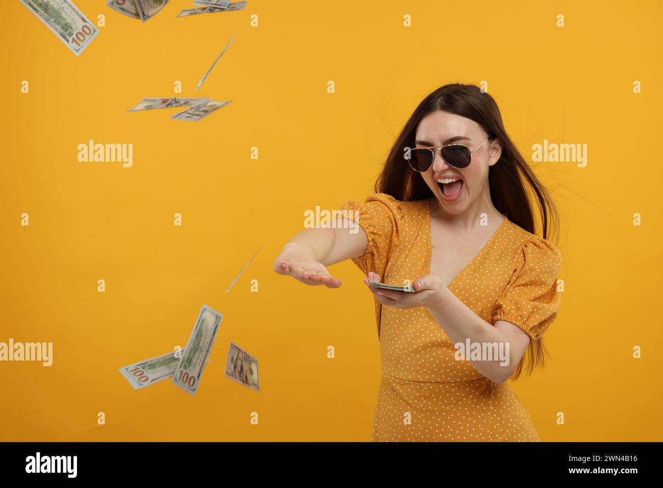 Young female lottery winner throwing hi-res stock photography and ...