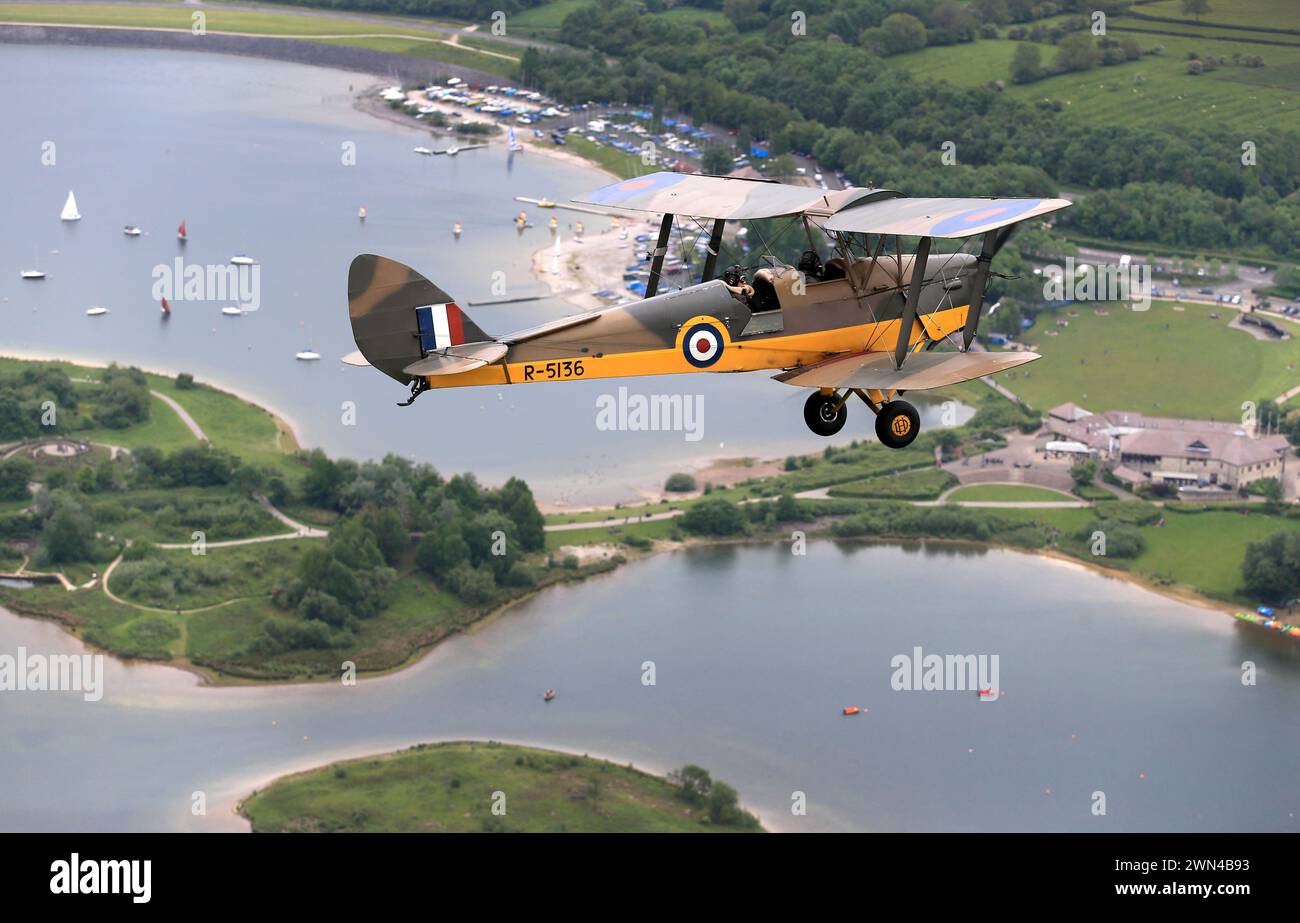 Tiger Moth flies over Carsington Water, Derbyshire Peak District Stock ...